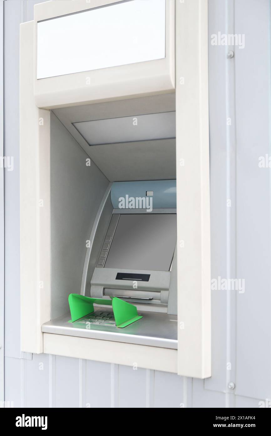 Modern automated cash machine with screen outdoors Stock Photo - Alamy