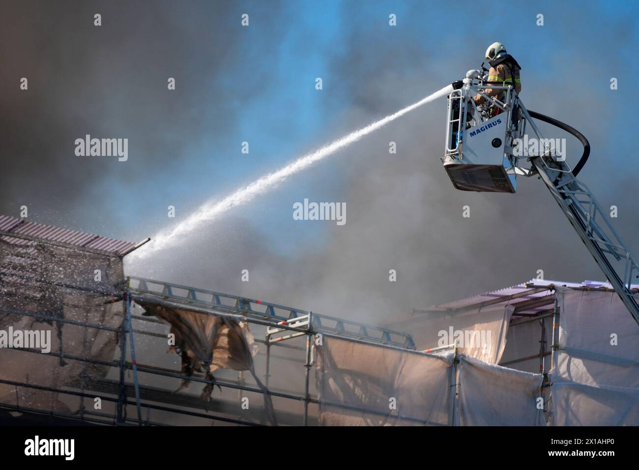 Copenhagen, Denmark. 16th Apr, 2024. Firefighters are working in ...