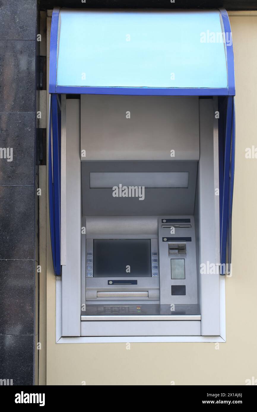 Modern automated cash machine with screen outdoors Stock Photo - Alamy