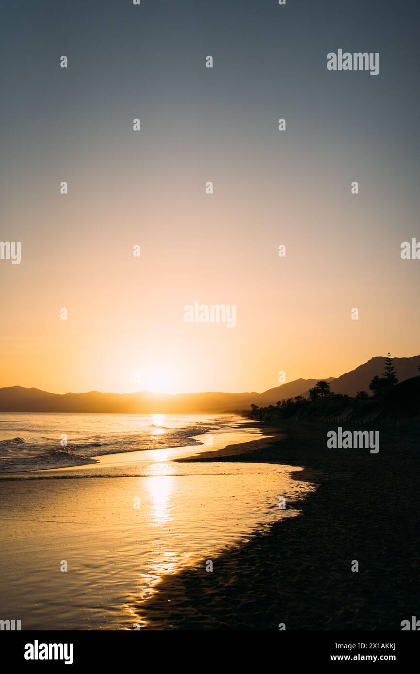 The sun dips below the horizon, casting a calming golden hue over the ...