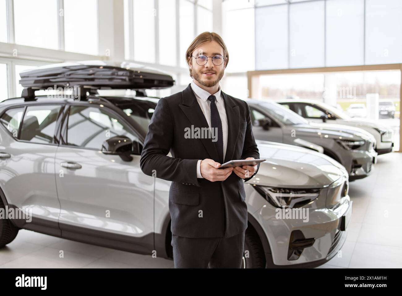 Successful car dealership manager tablet hi-res stock photography and ...