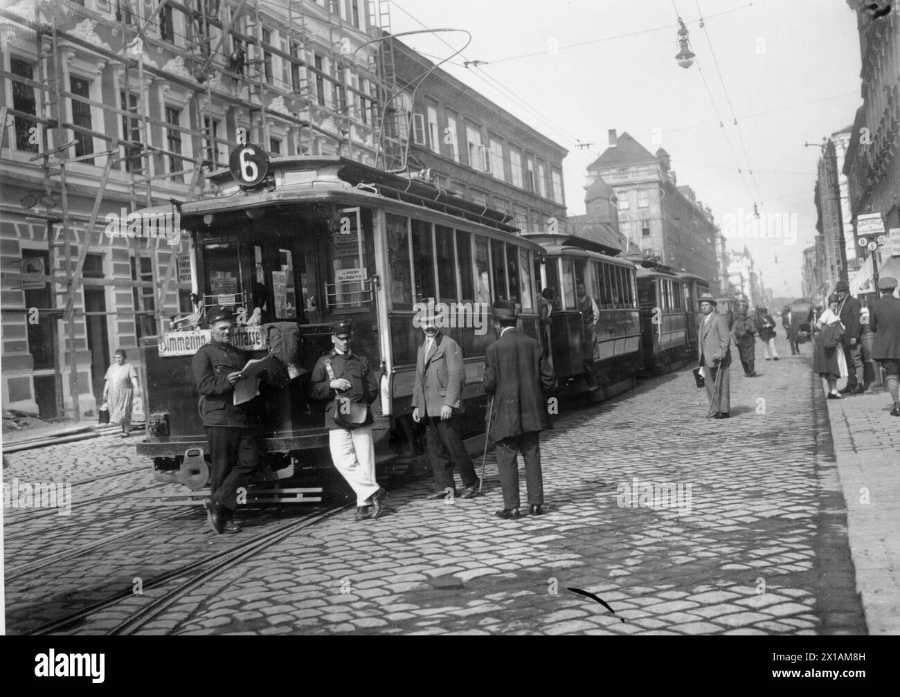 Tramway 6, at a stop, conductor in front of the railcar standing, 1925 ...