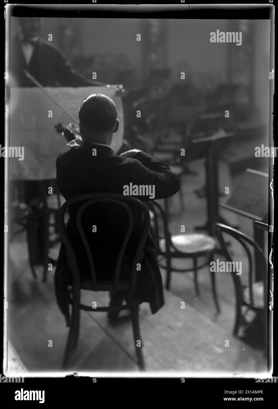 Violin sitting on chair Black and White Stock Photos & Images - Alamy