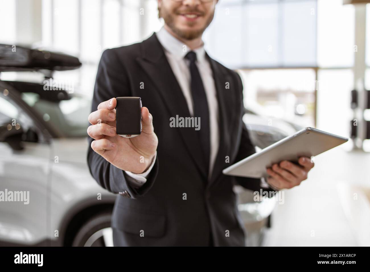 Selective focus on keys in hand of Caucasian male car dealer. Car ...