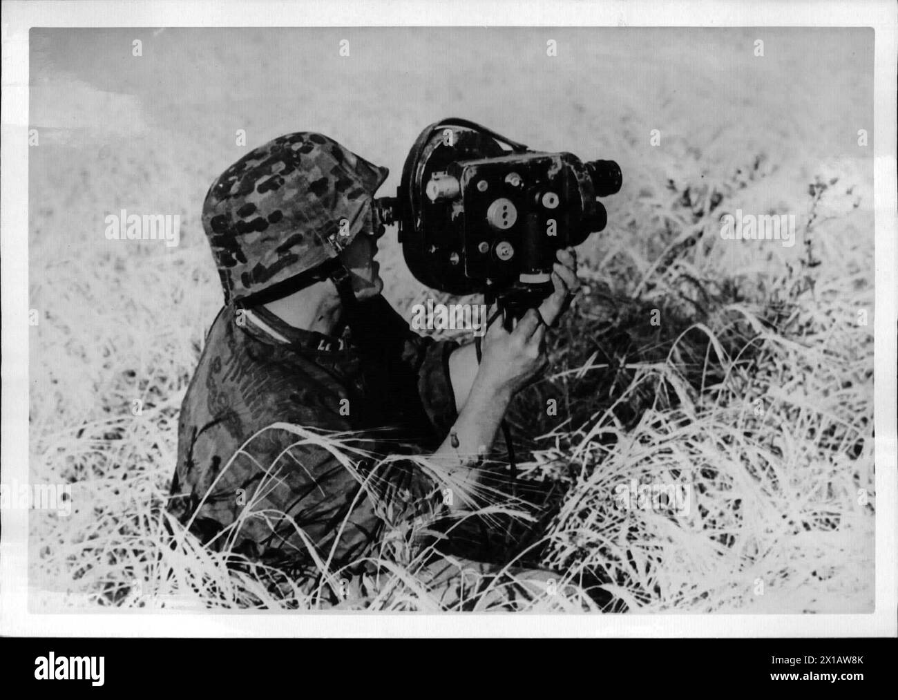 A reporter of the SS propaganda company, making a film in front line ...