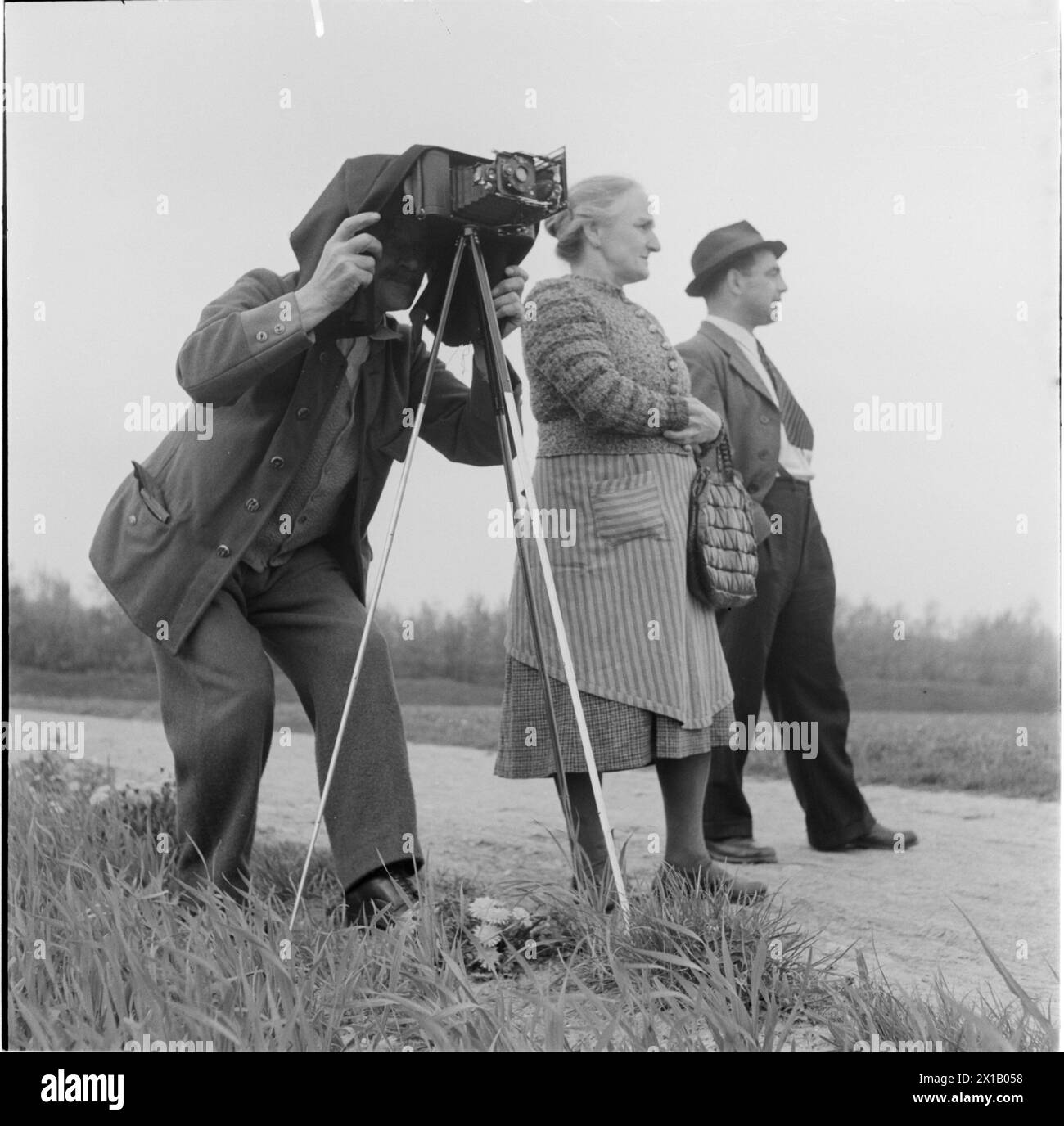 Transport of the Pummerin from Linz to Vienna, photographer at roadside ...