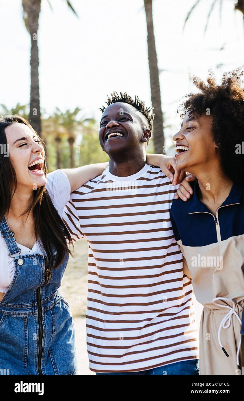Young multiracial friends having fun during summer vacation outdoors ...