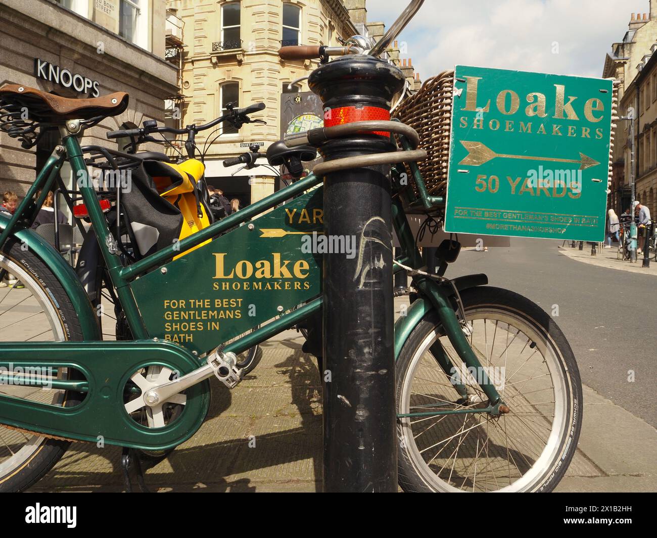 Green repurposed bicycle advertising traditional cobbler Loake ...