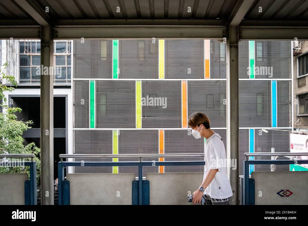 Pedestrians walking along a sky walk at Sala Daeng BTS skytrain station ...