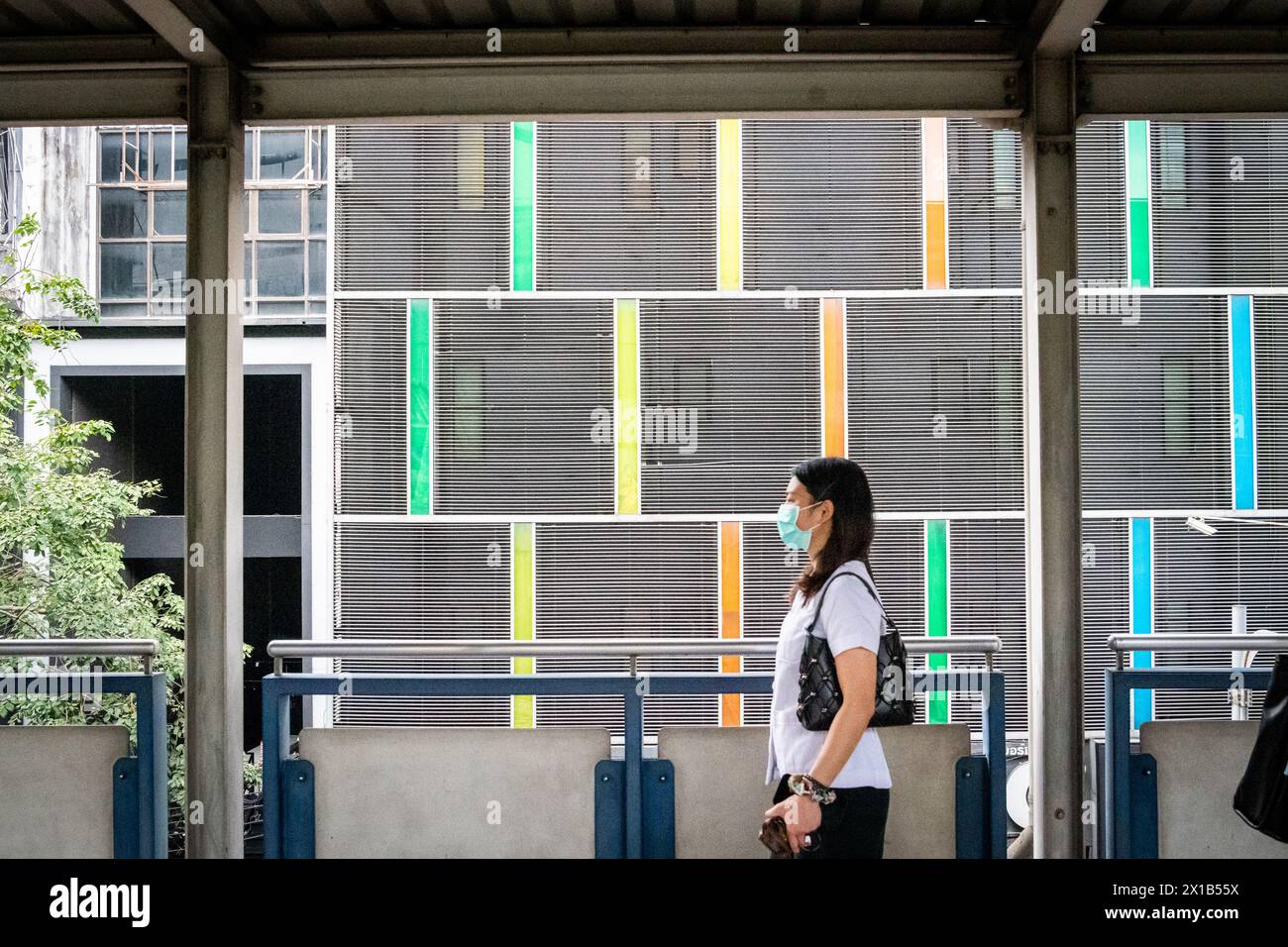 Pedestrians walking along a sky walk at Sala Daeng BTS skytrain station ...