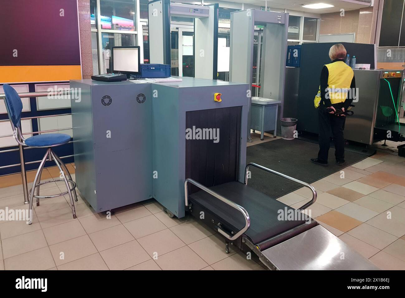 Security checkpoint with scanner machines are scanning luggages ...