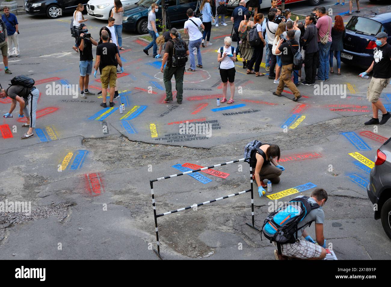 Young people activists painting offensive lettering against Putin on ...
