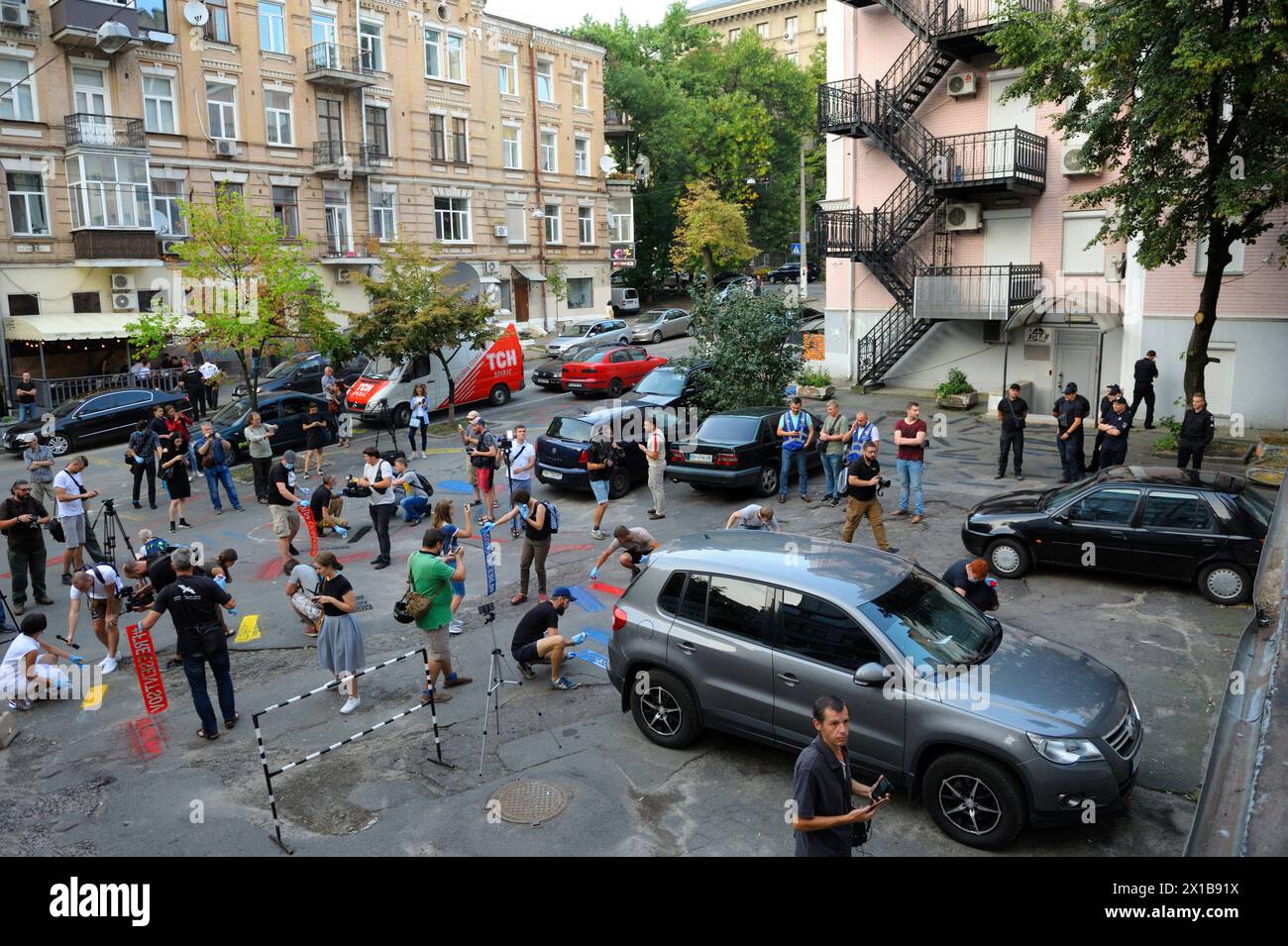 Young people activists painting offensive lettering against Putin on ...