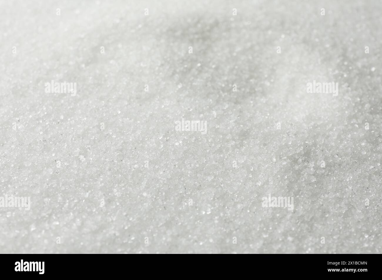 White granulated sugar as background, closeup view Stock Photo - Alamy