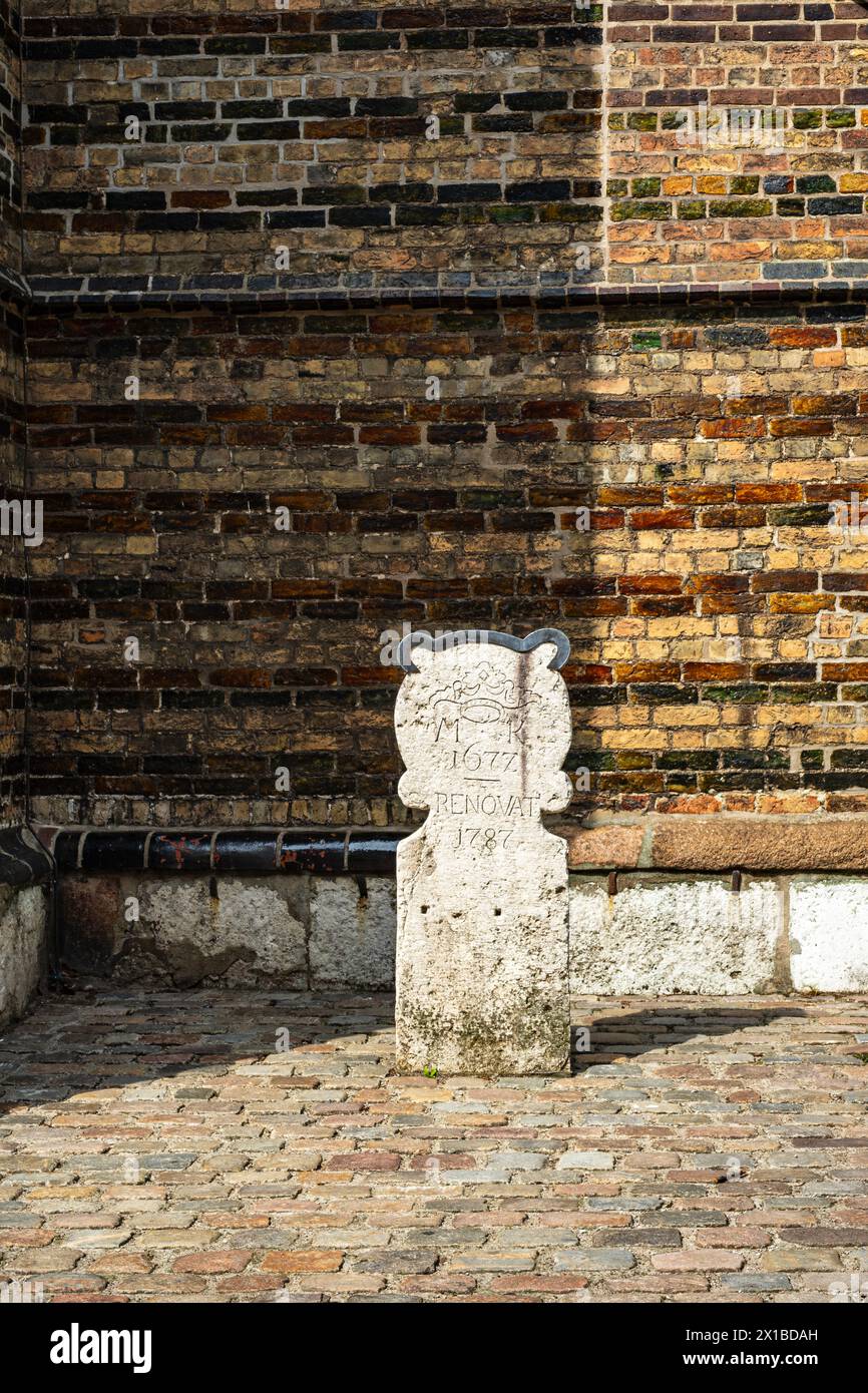 Boundary stone with the coat of arms and initials of St Mary's Church ...