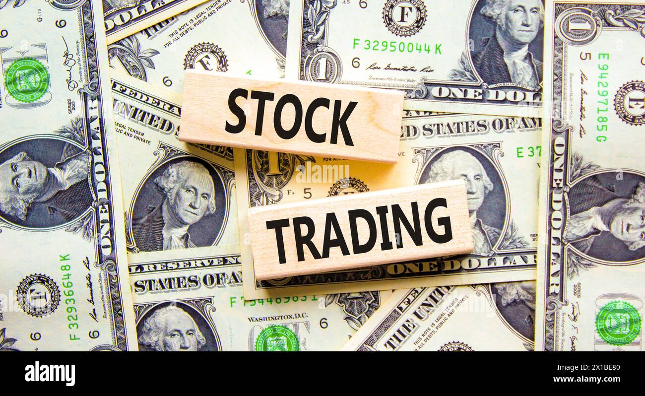 Stock trading symbol. Concept words Stock trading on beautiful wooden ...