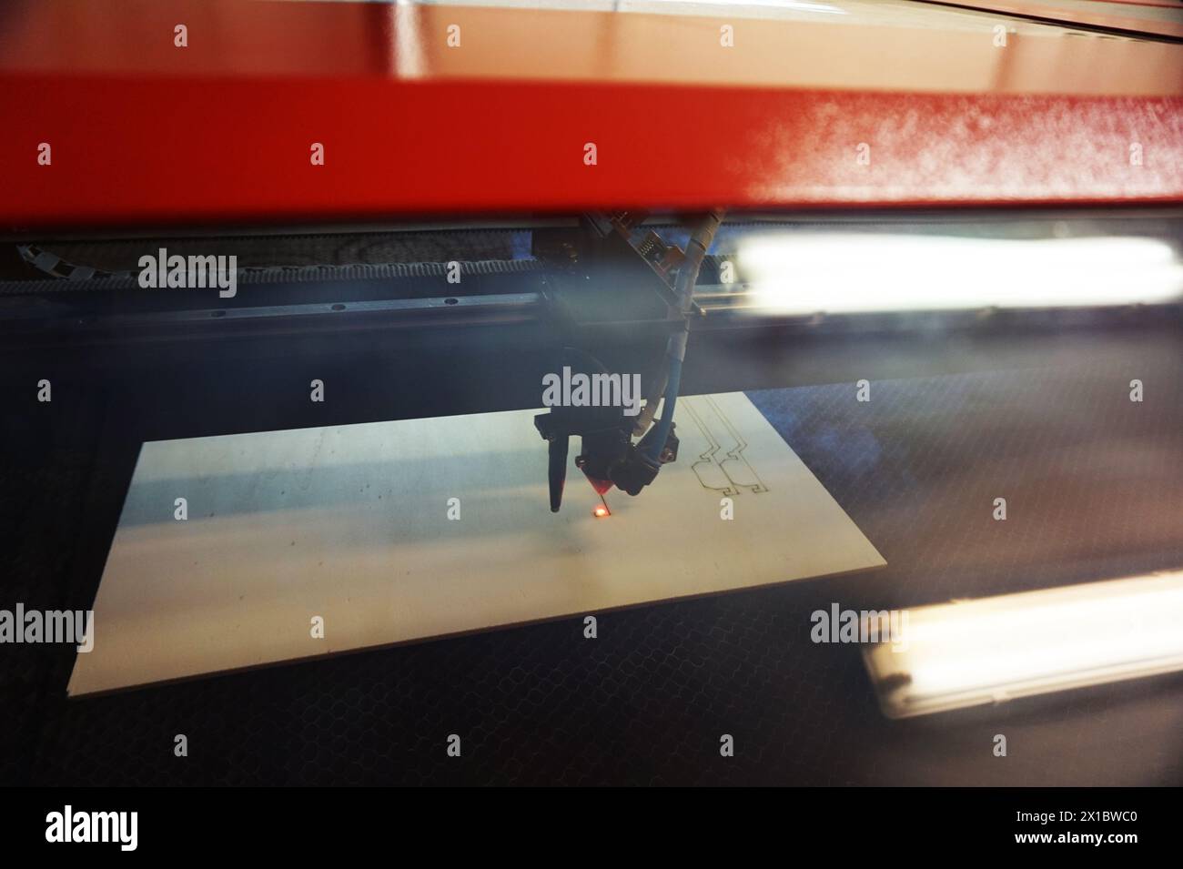 laser light is cutting piece of wood Stock Photo - Alamy