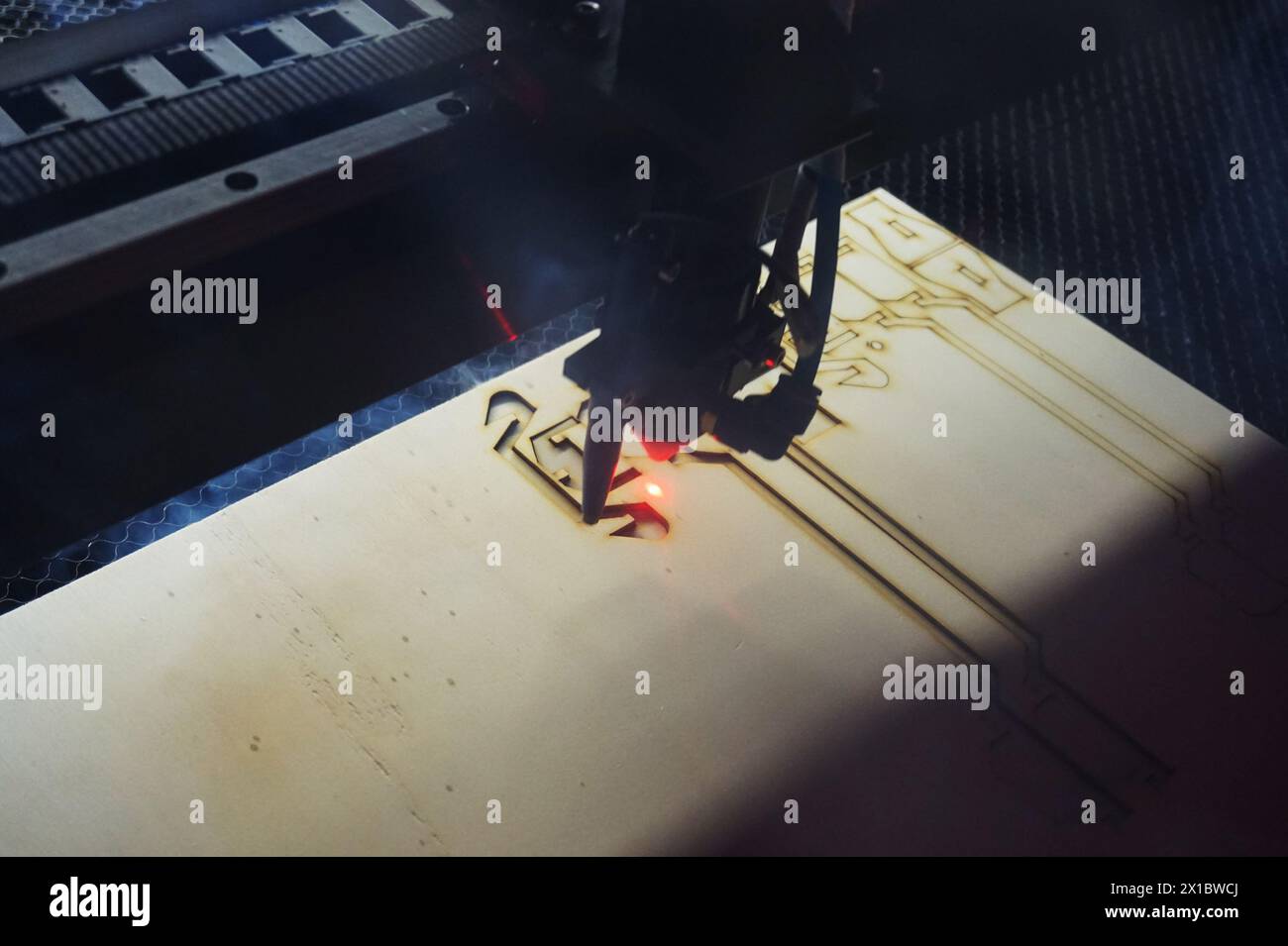 laser light is cutting piece of wood Stock Photo - Alamy