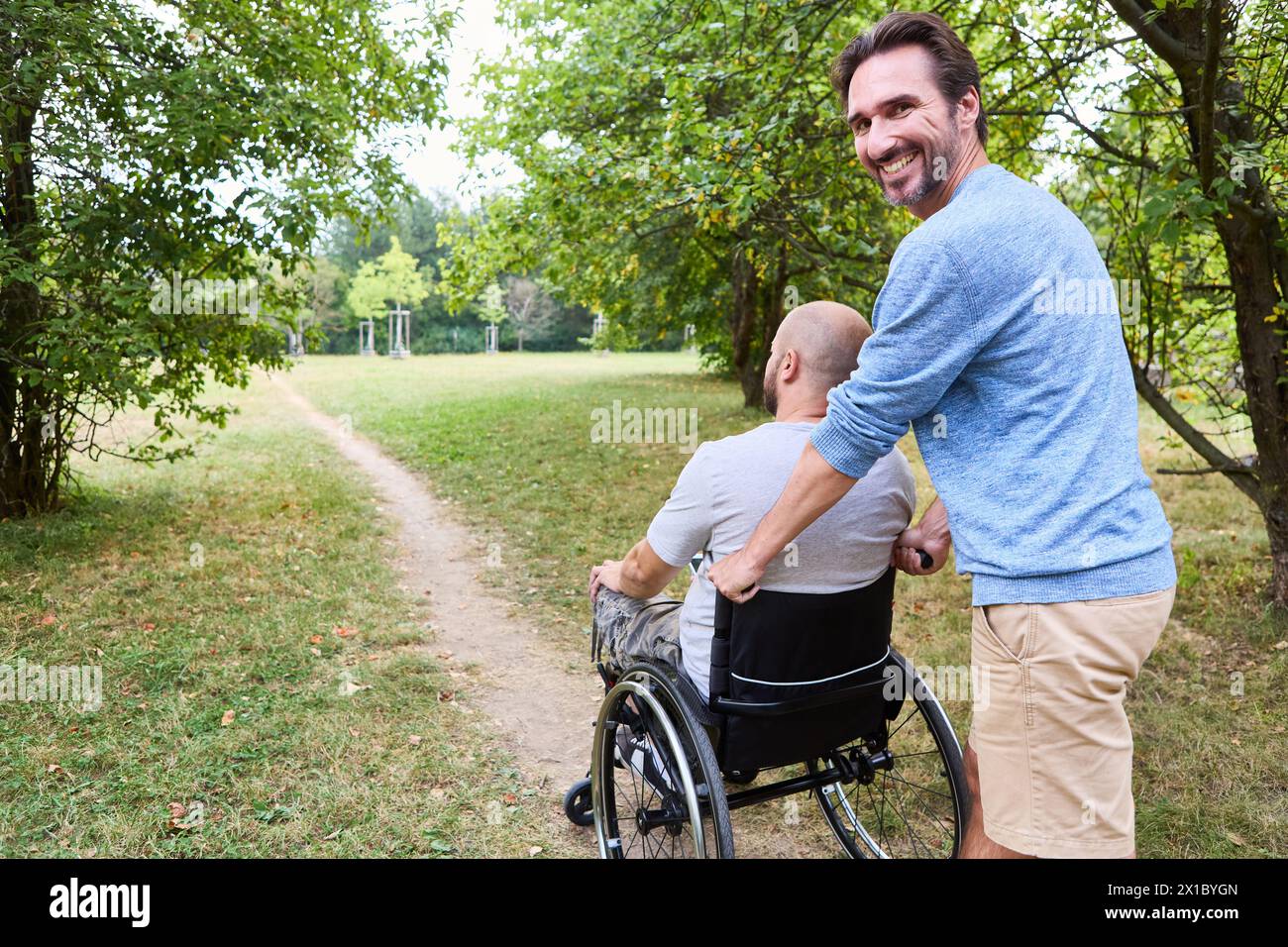 Smiling wheelchair hi-res stock photography and images - Alamy