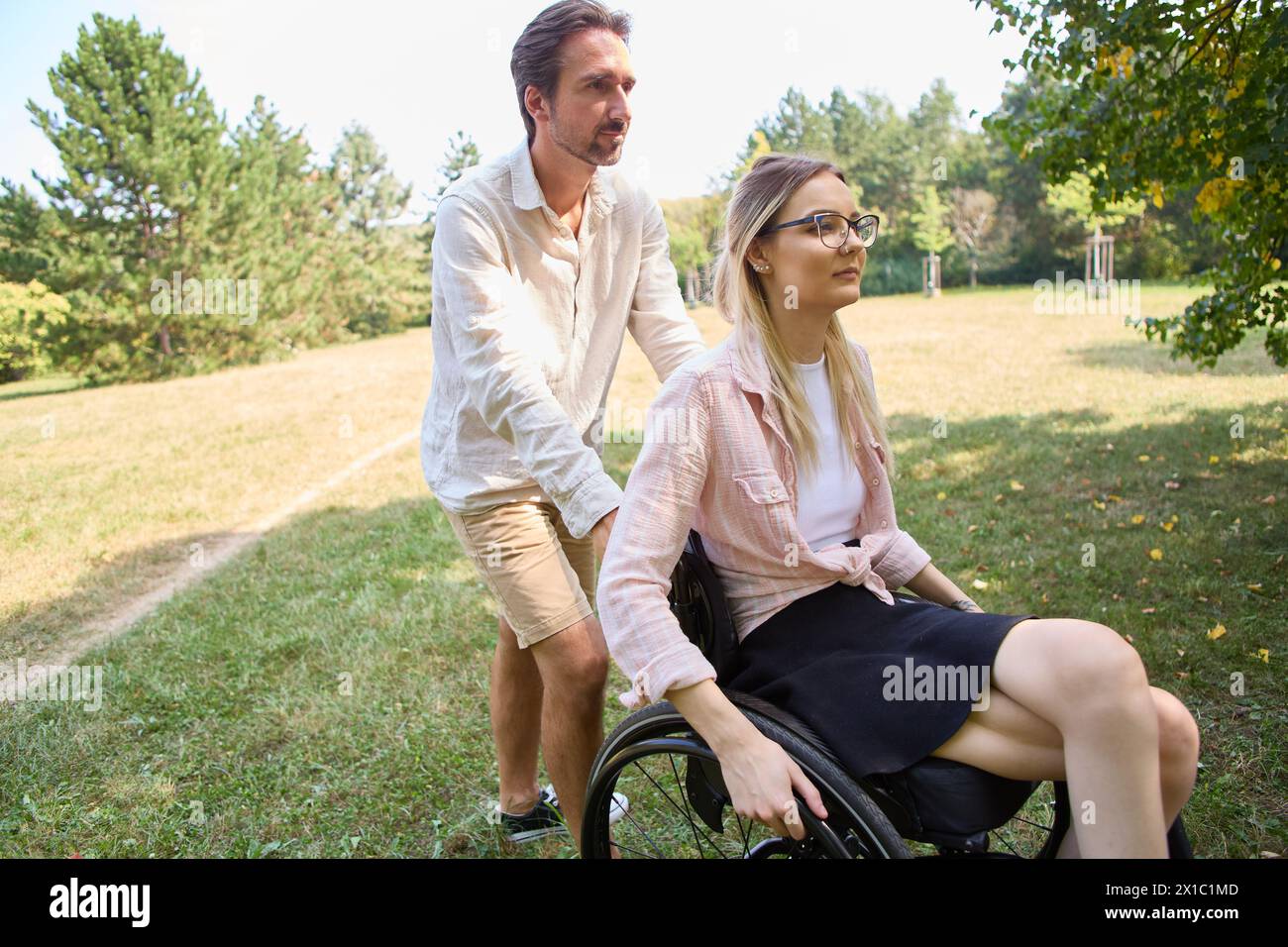 Inclusive image of a man and a content woman who has mobility ...