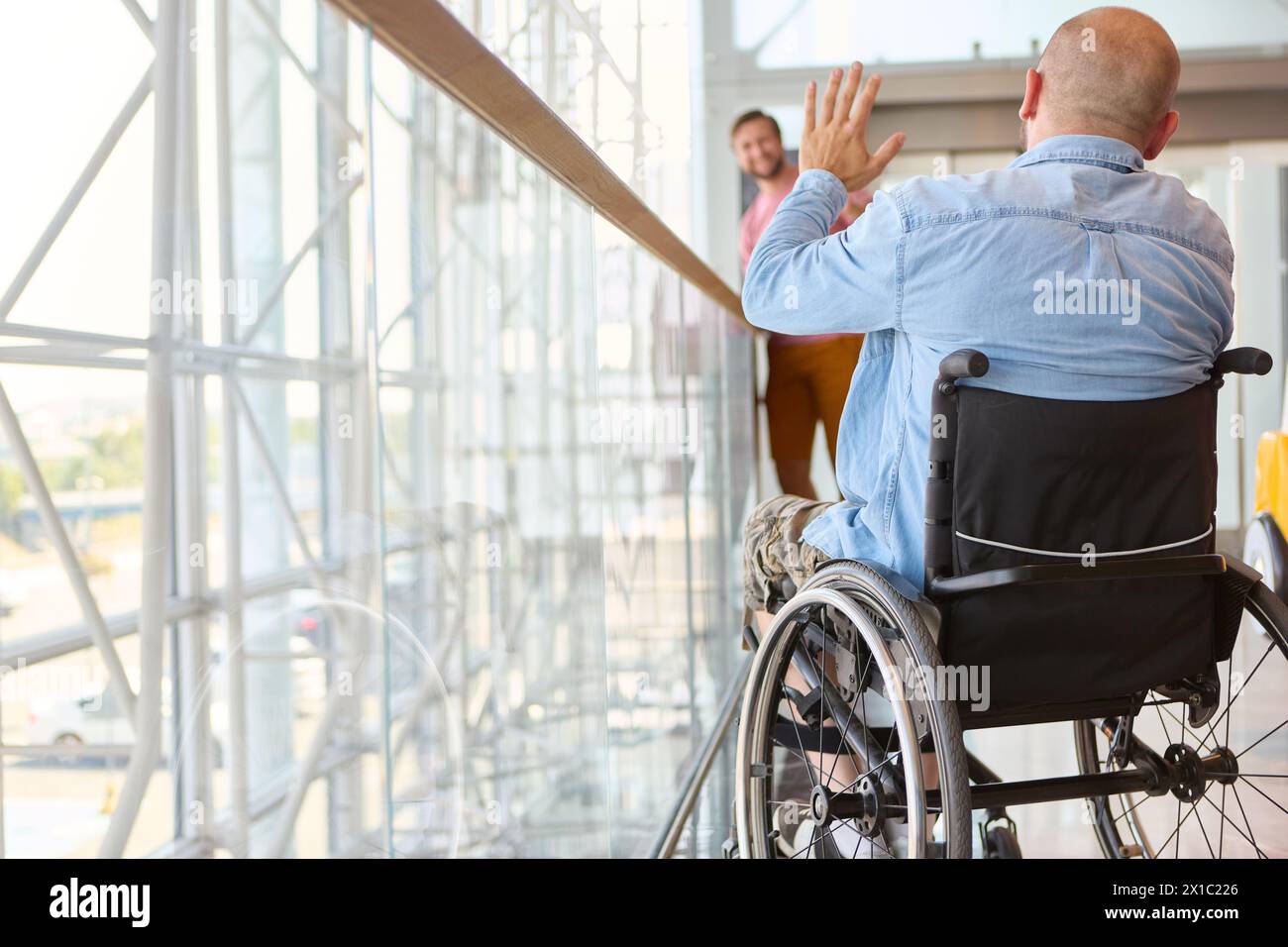 Disabled friends giving high hi-res stock photography and images - Alamy