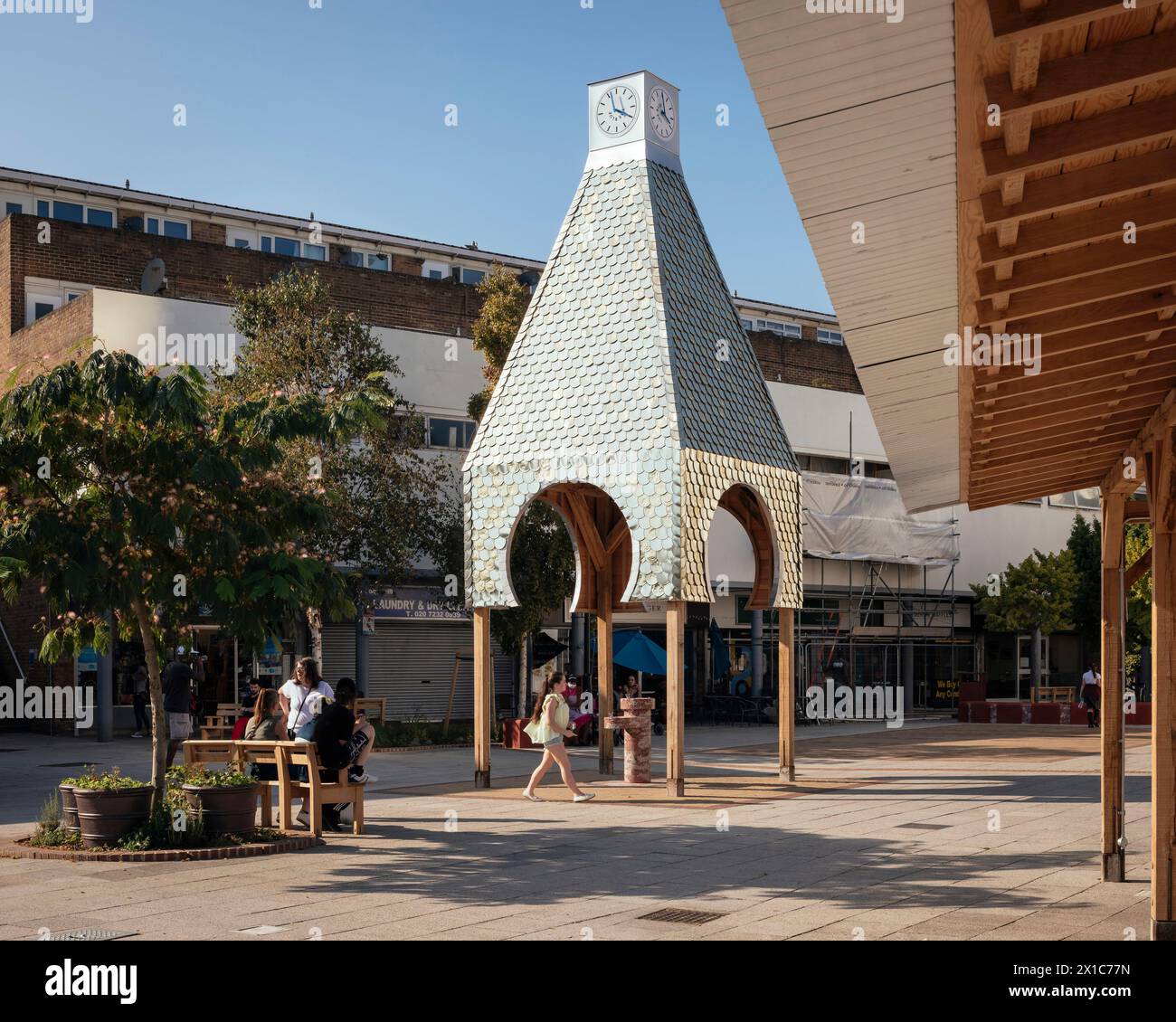 Bermondsey Market place, view across public space with silver clock ...
