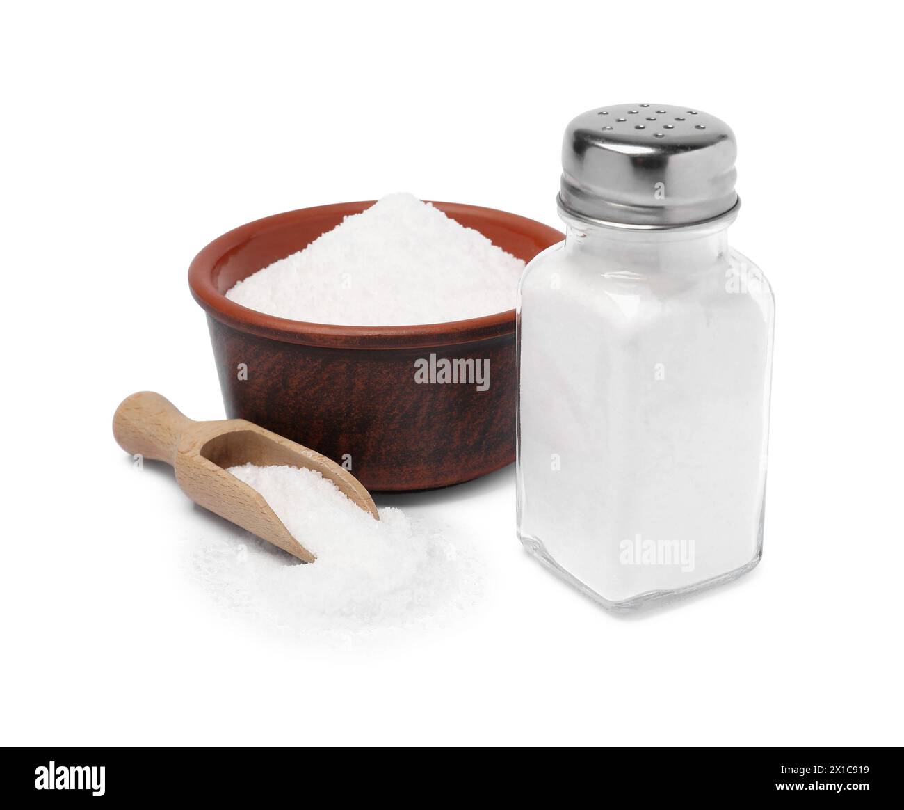 Natural salt in shaker, bowl and scoop isolated on white Stock Photo ...