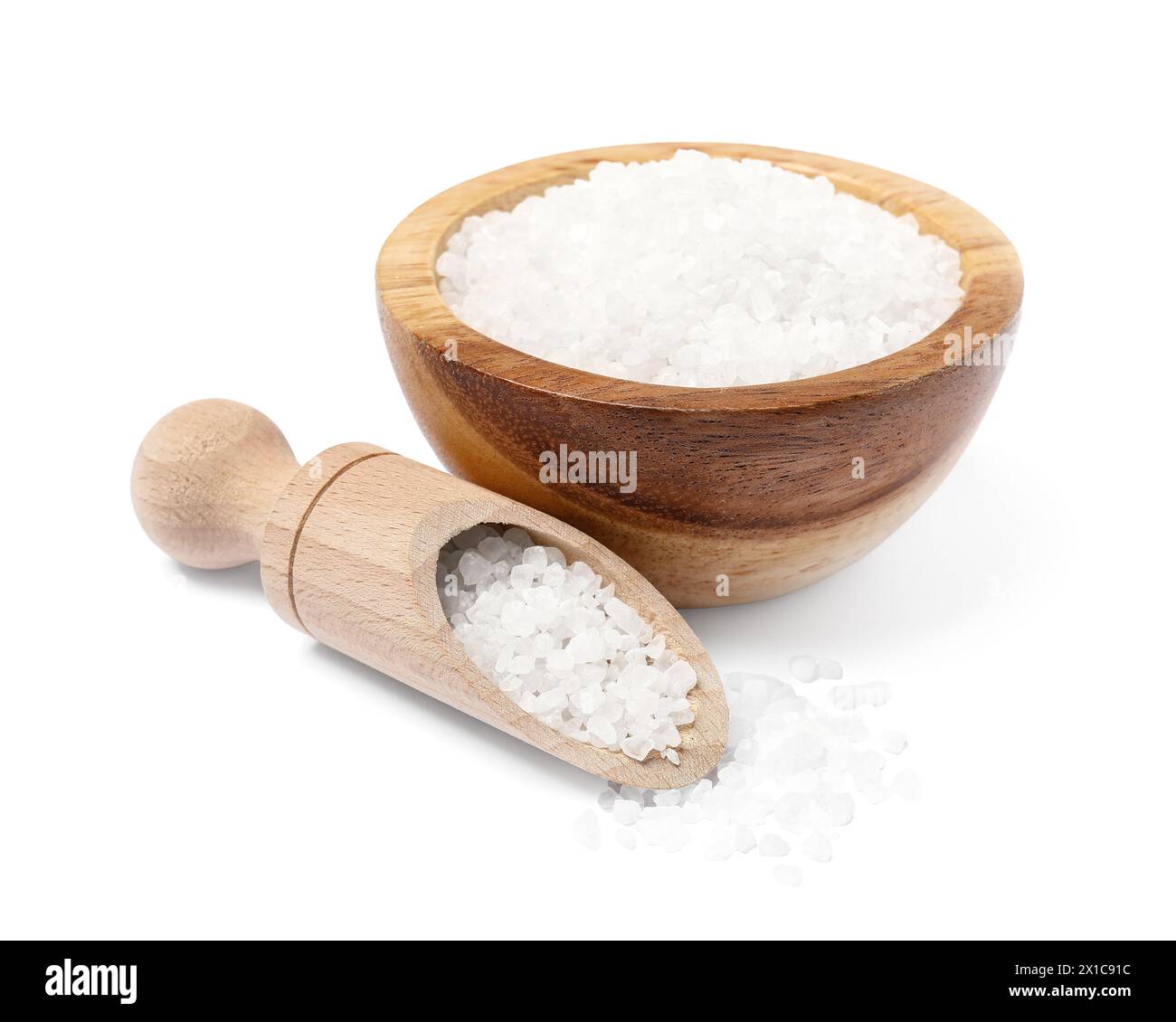 Natural salt in wooden bowl and scoop on white background Stock Photo ...