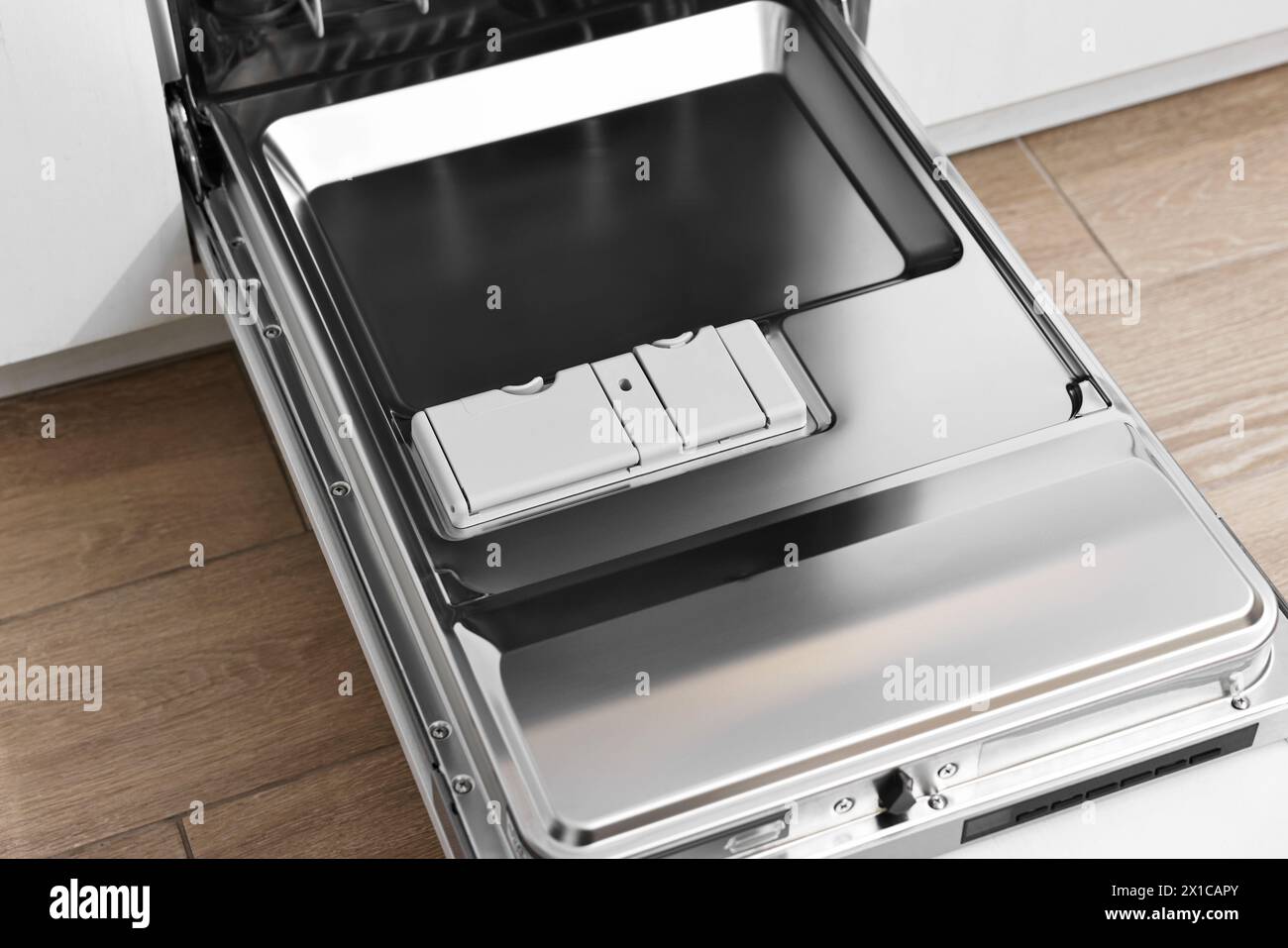 Open clean empty dishwasher in kitchen. Home appliance Stock Photo - Alamy