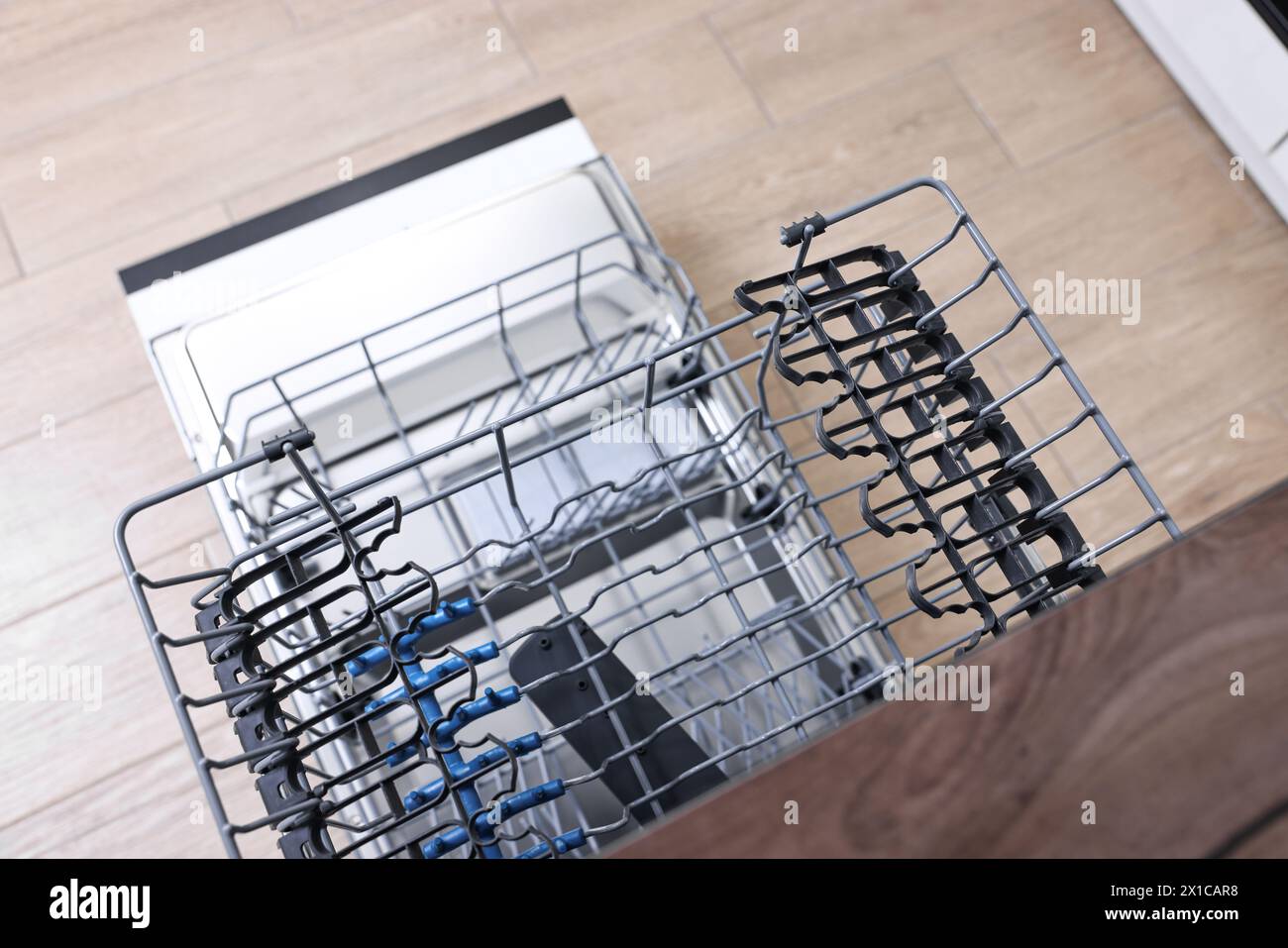Open clean empty dishwasher in kitchen, top view Stock Photo - Alamy