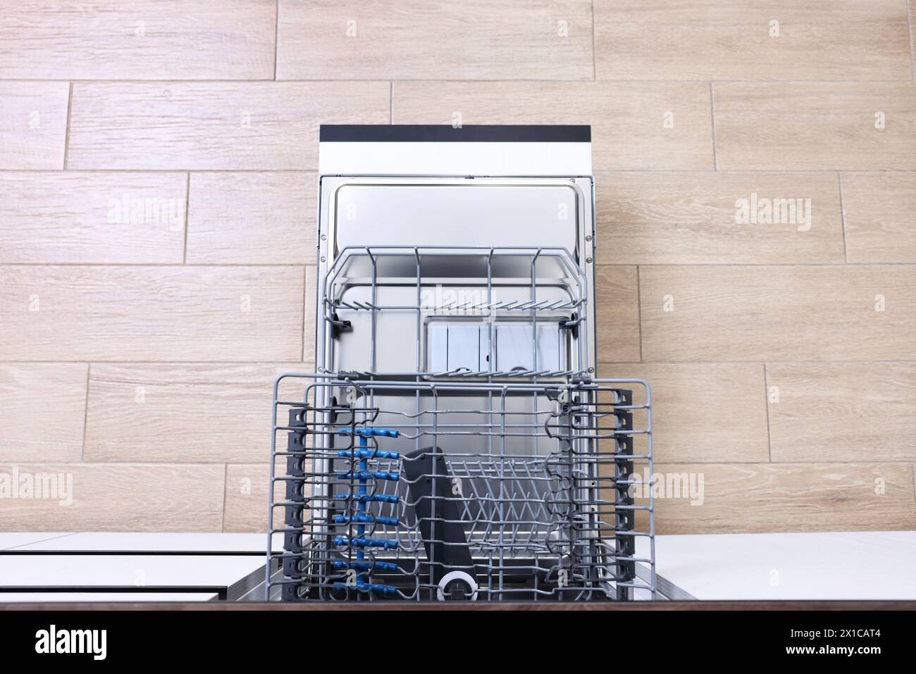 Open clean empty dishwasher in kitchen, top view Stock Photo - Alamy