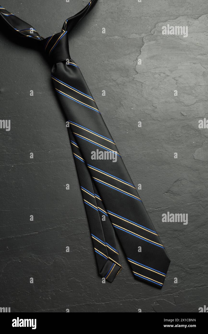 One striped necktie on grey textured table, top view Stock Photo - Alamy