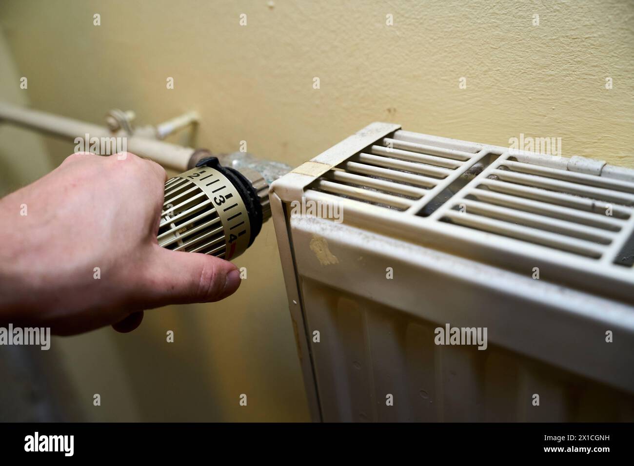 Augsburg, Bavaria, Germany - April 13, 2024: A man s hand turns the ...