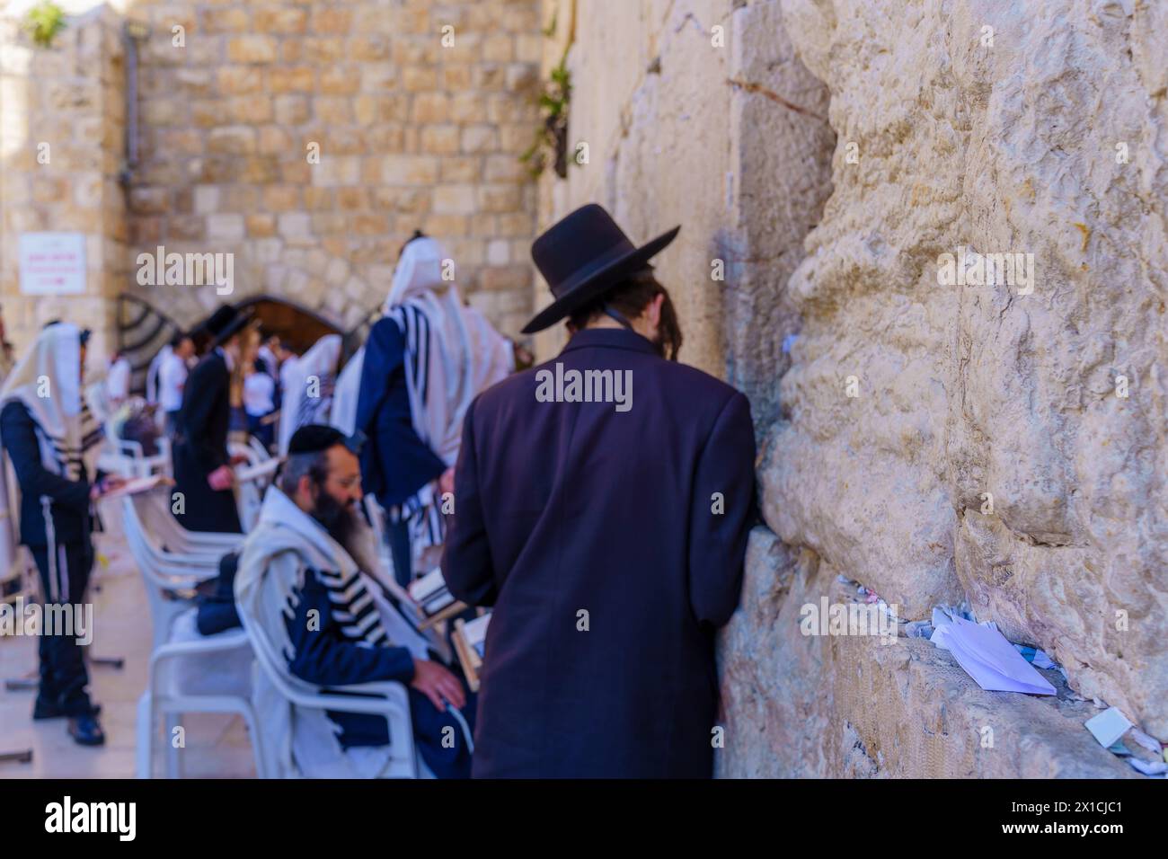 Jerusalem, Israel - April 12, 2024: View of prayer notes between the ...