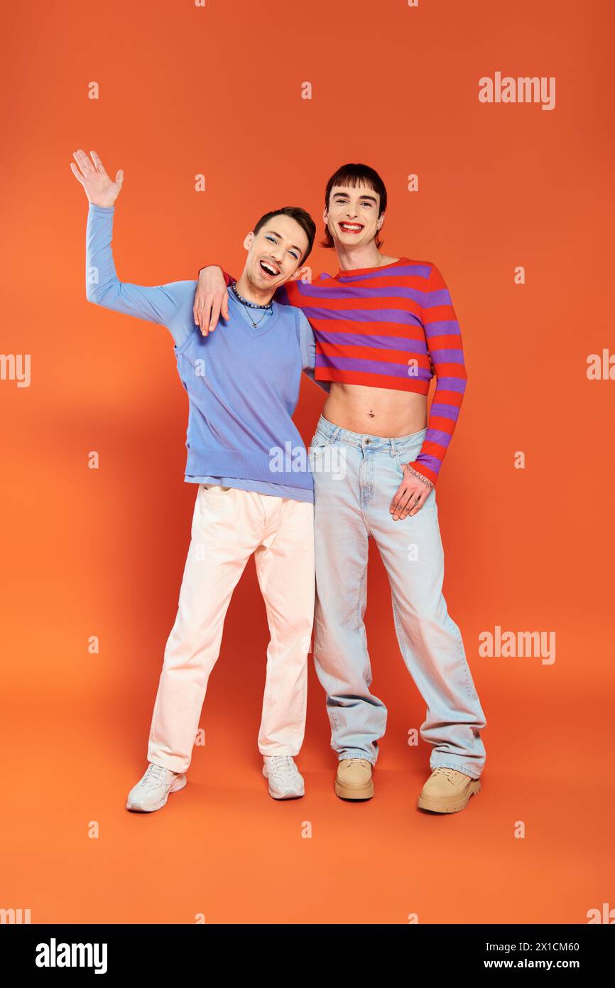 joyous attractive gay friends with vivid makeup posing together on ...