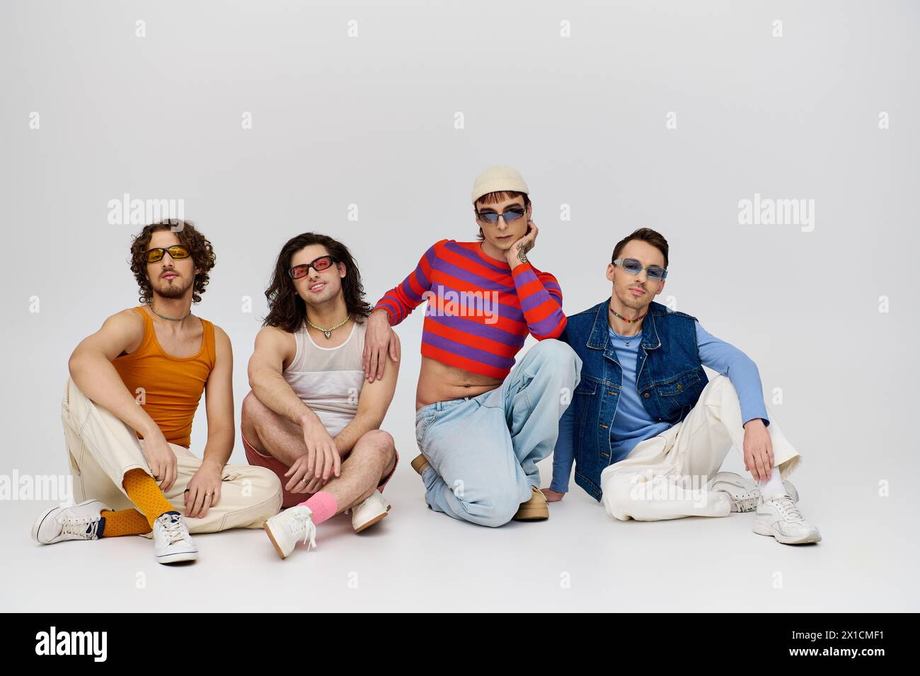four appealing cheerful gay friends with stylish sunglasses posing ...