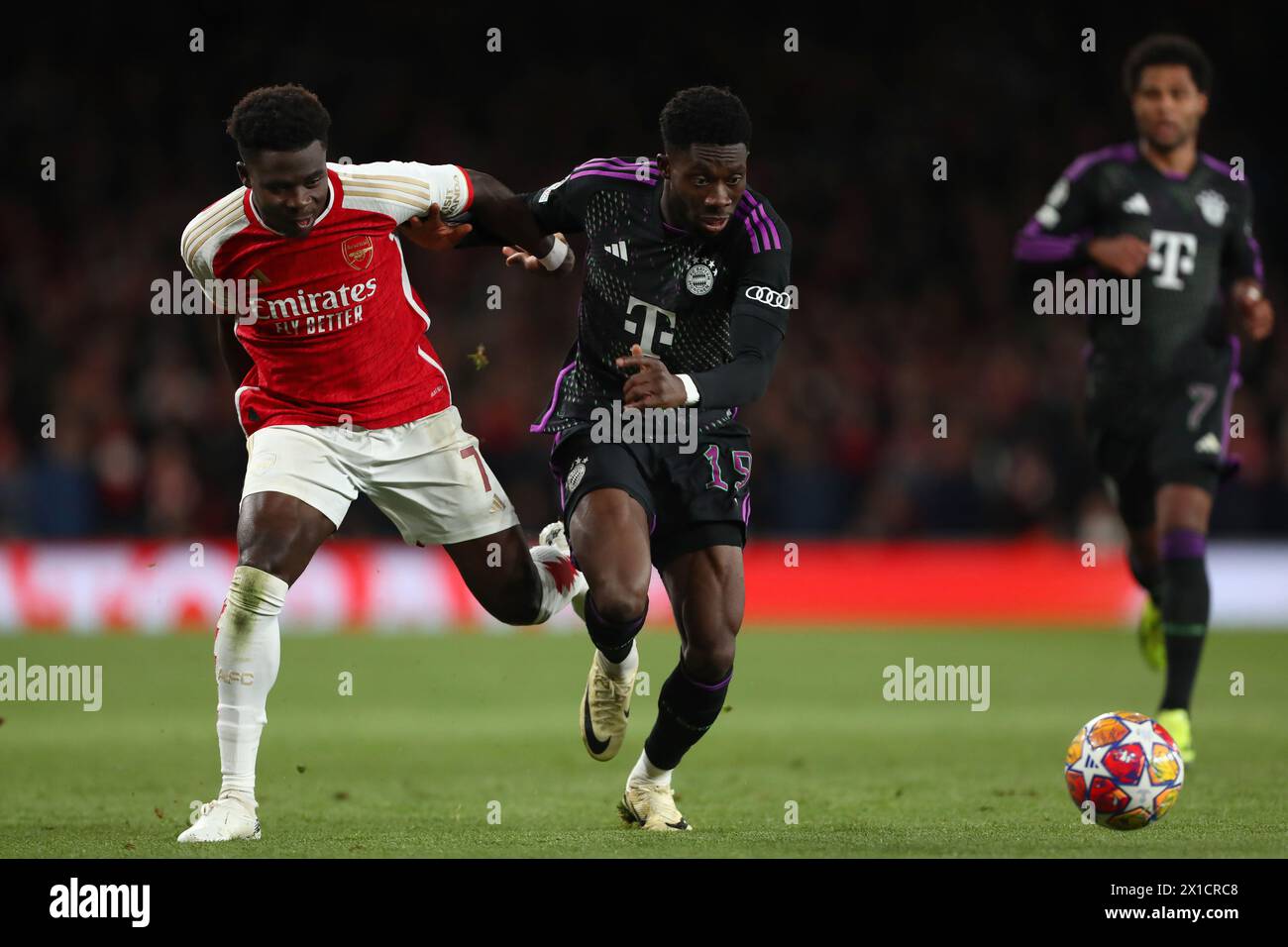 Bukayo Saka of Arsenal and Alphonso Davies of Bayern Munich - Arsenal v ...