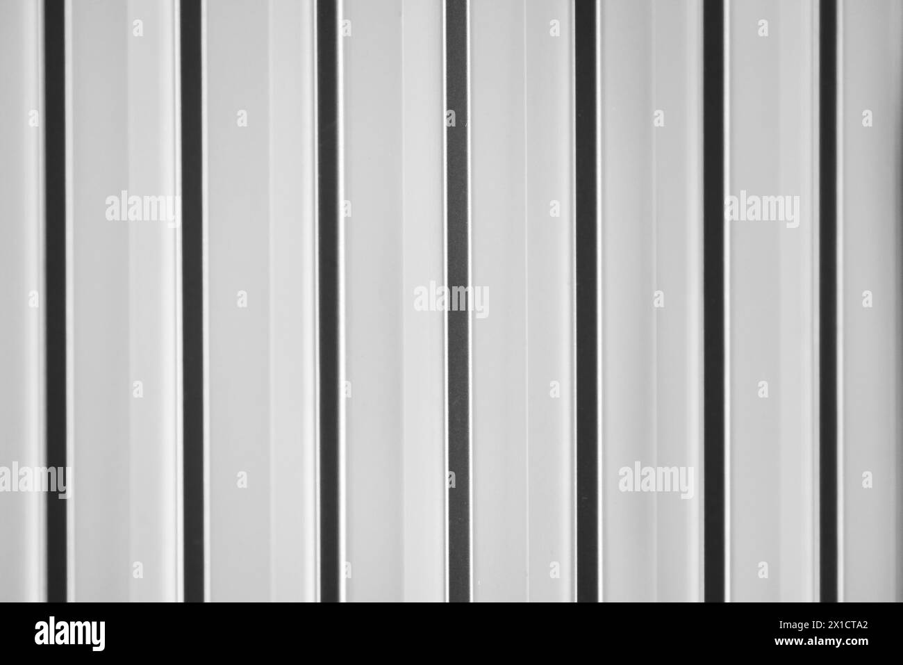 White ridged metal wall, close up background photo with selective soft ...