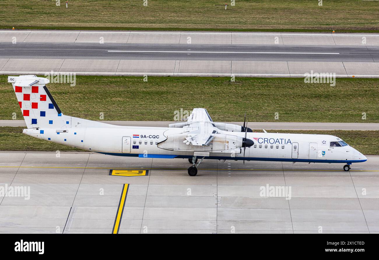 A Bombardier Dash 8 Q400 from Croatia Airlines taxis to the runway at ...