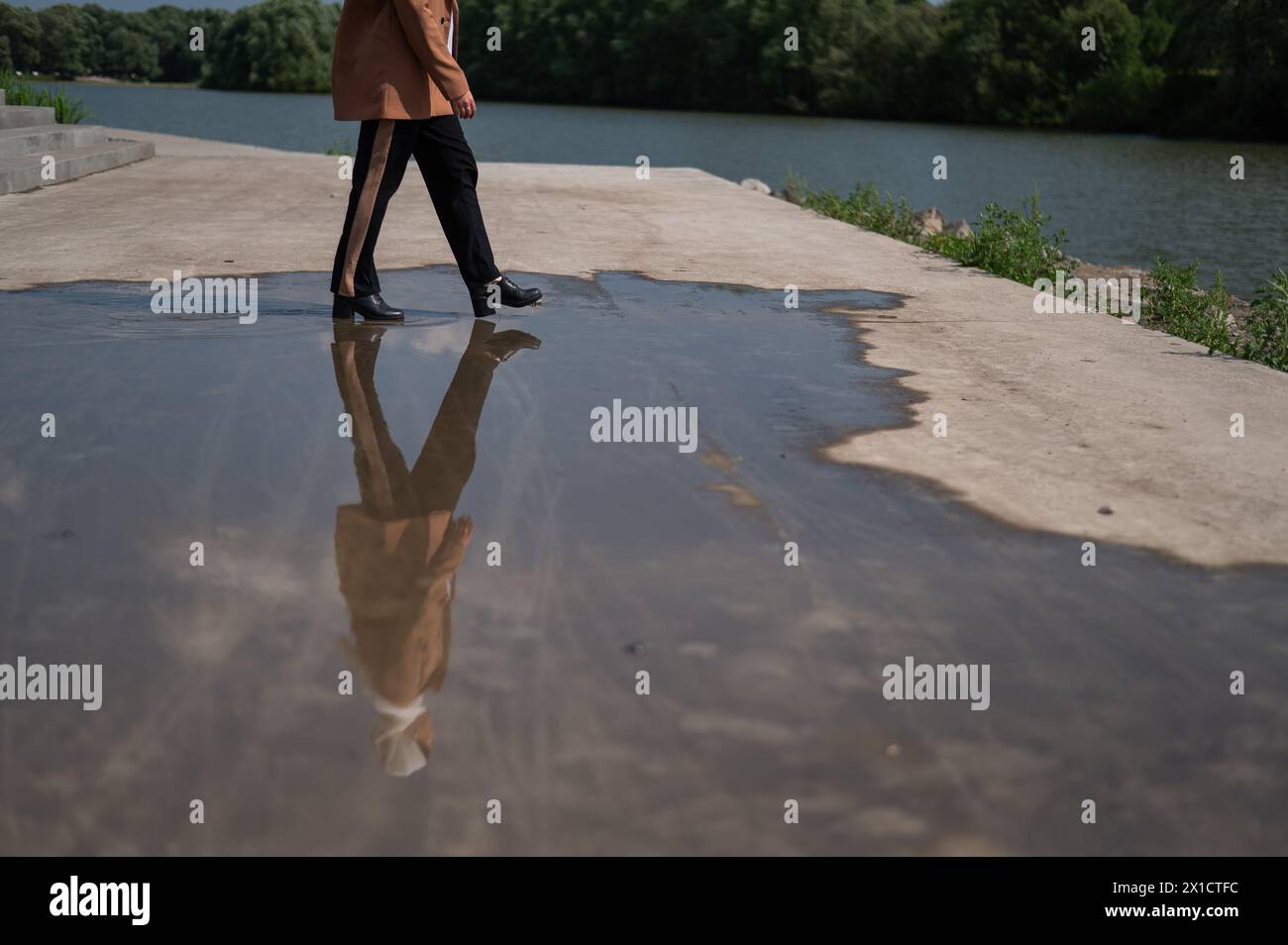 Female walking through flood water hi-res stock photography and images ...
