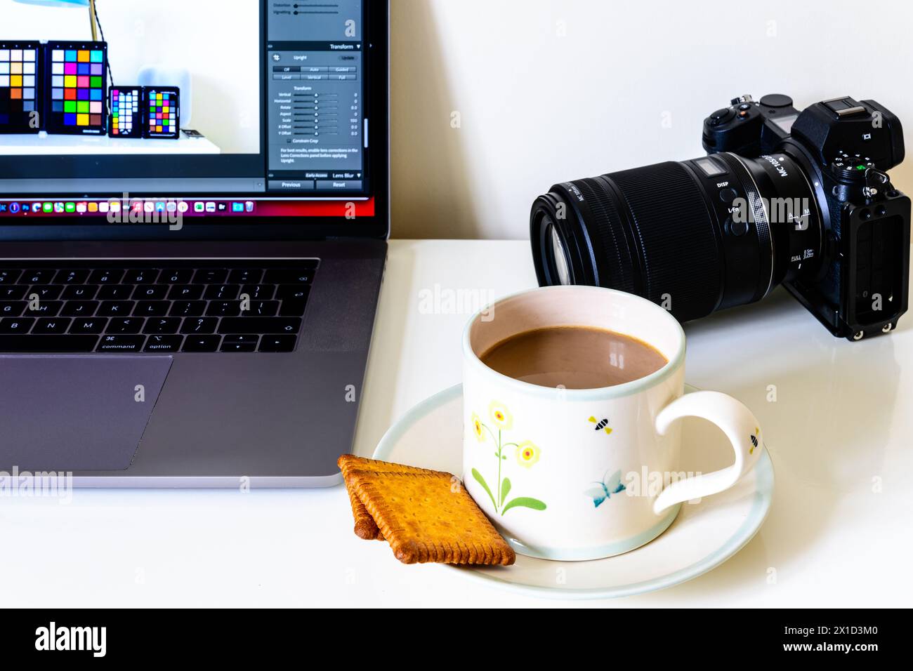 Coffee break during the post processing of images from a professional ...