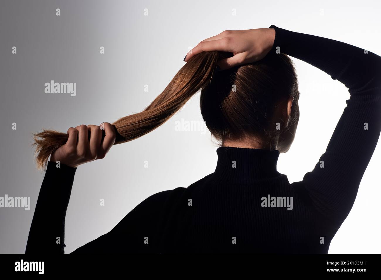 Long hair tied up hi-res stock photography and images - Alamy