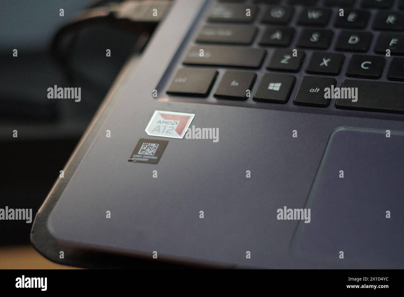 AMD A12 sticker on a gray laptop Stock Photo - Alamy