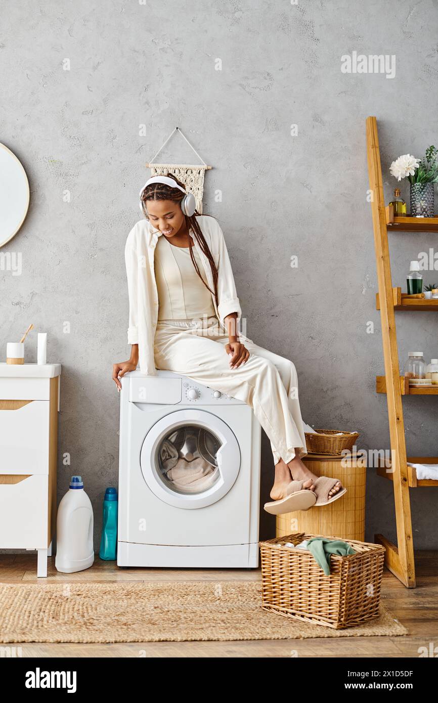 An African American woman with afro braids sitting proudly on top of a ...