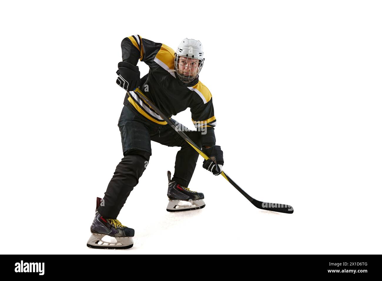 Male athlete, hockey player in black uniform and helmet training ...