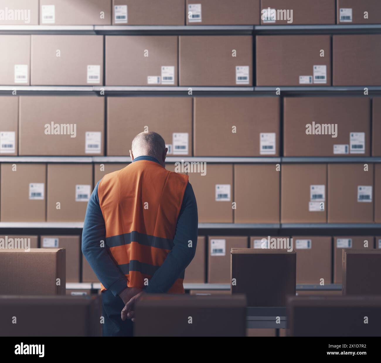 Sad frustrated warehouse worker checking boxes on the conveyor belt ...