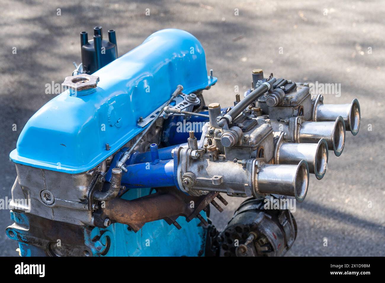 Blue painted dismantled old off-road car engine Stock Photo - Alamy