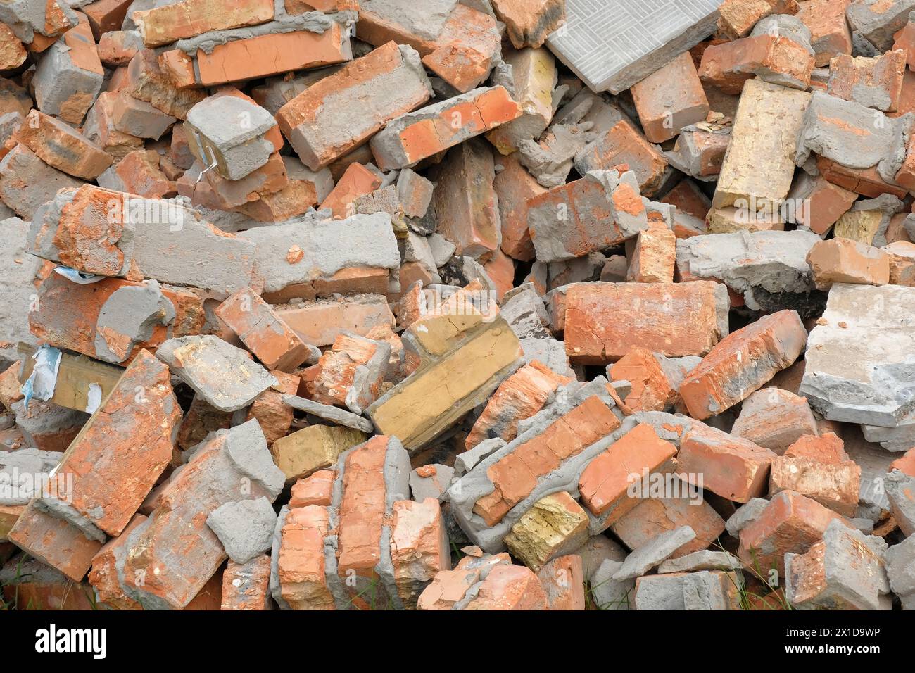 A pile of red broken bricks. Brick background Stock Photo - Alamy
