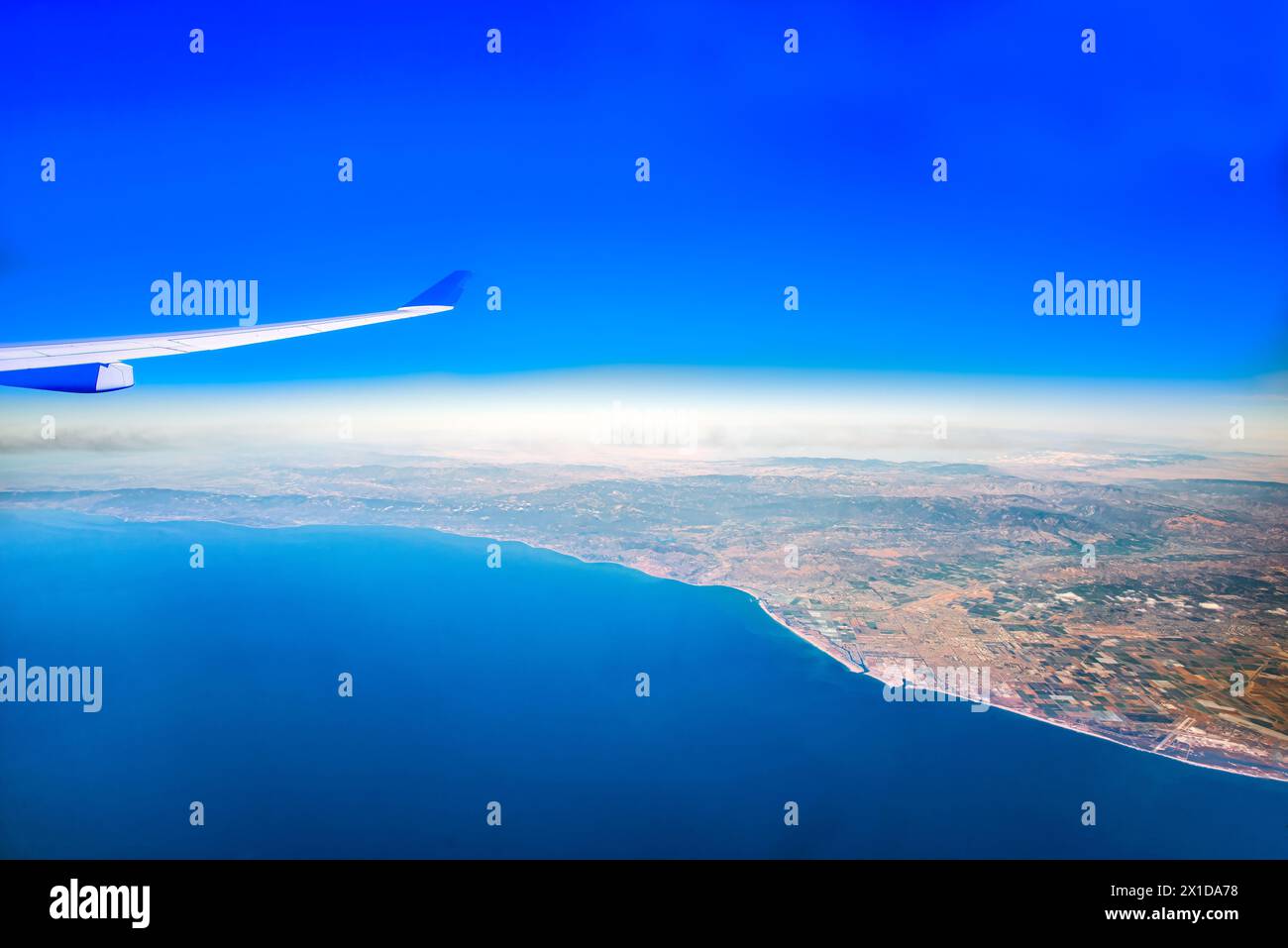"California Bound: An aircraft's wing soars over the Pacific Ocean ...