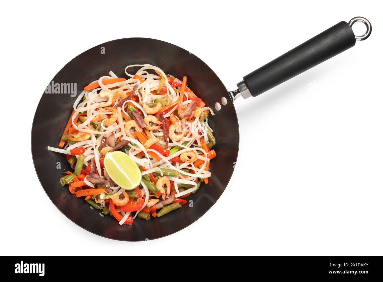 Shrimp stir fry with noodles and vegetables in wok isolated on white ...